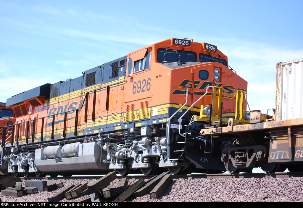 BNSF 6926 waits to roll eastbound with her sister BNSF 6688 both C4's being utilized as Rear DPU ...